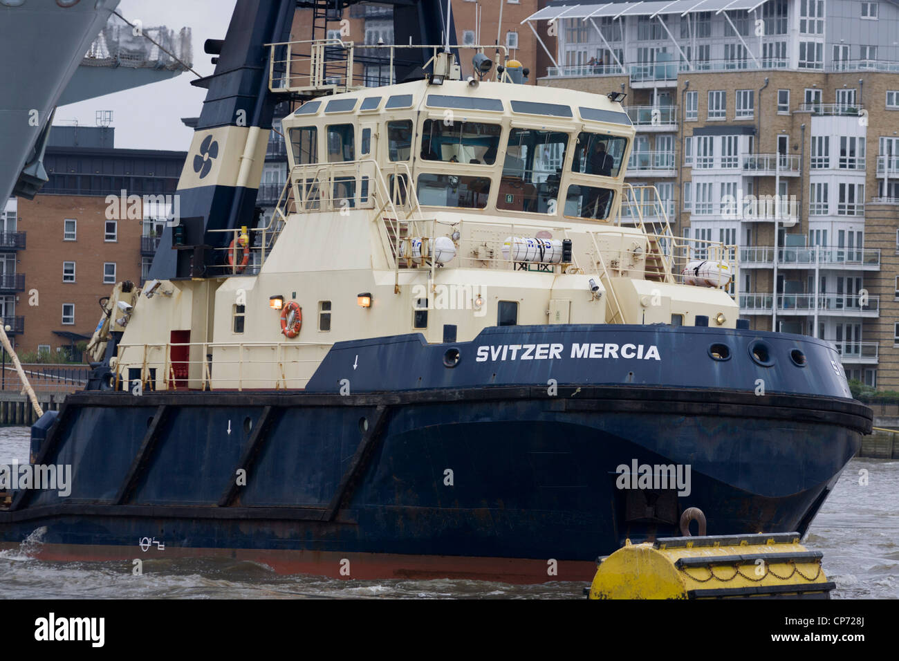 The tug and firefighting boat Svertzer Mercia pulling the Royal Navy ...