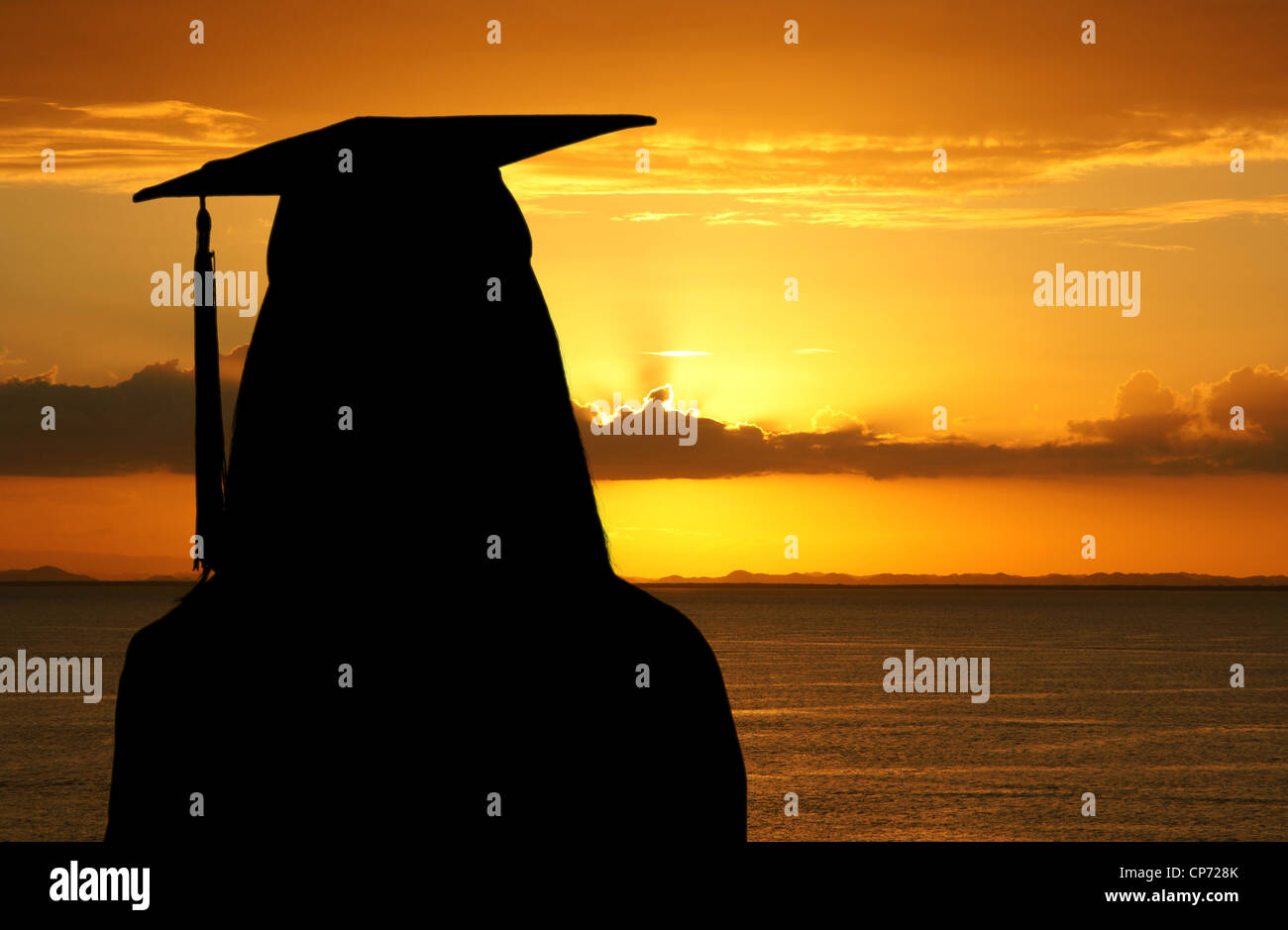Graduation of a teenage girl looking at the sunset Stock Photo - Alamy