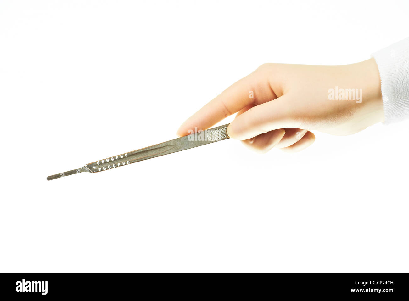Surgical instrument (scalpel handle) held by surgeons hand Stock Photo ...