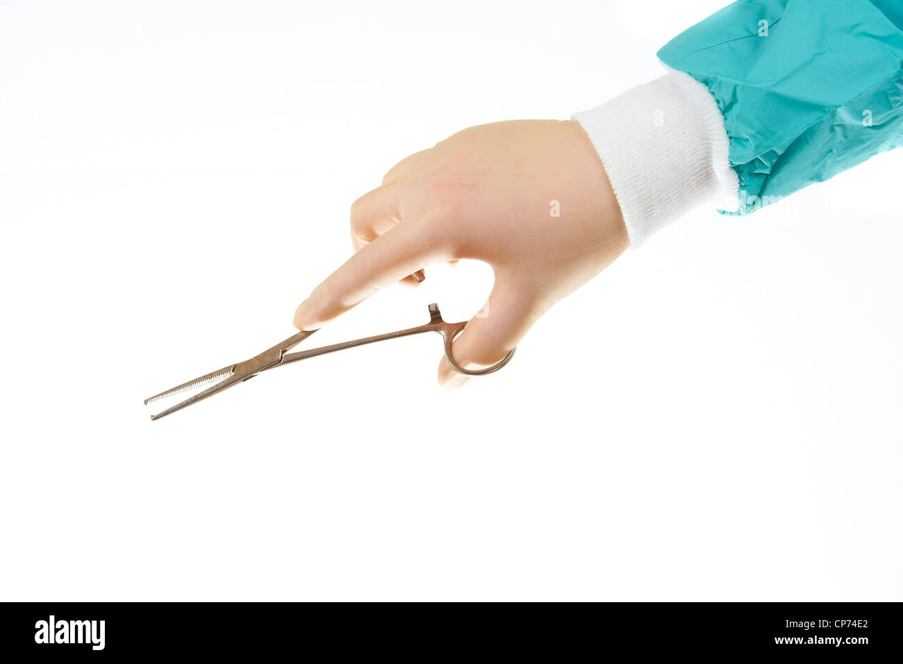 Surgical instrument (straight Kocher hemostat) held by surgeons hand ...