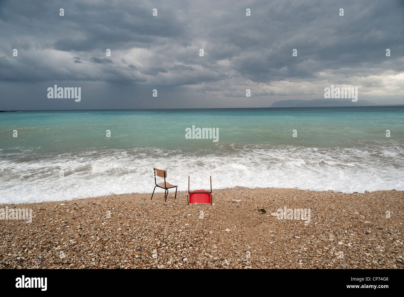 Two chairs in the surf Stock Photo - Alamy