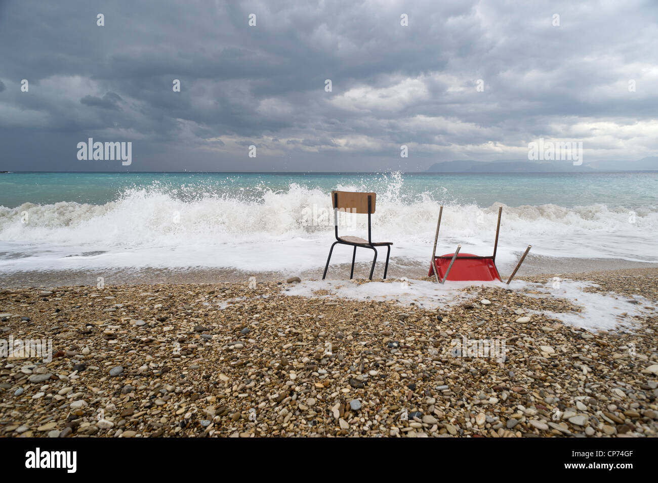 Two chairs in the surf Stock Photo - Alamy