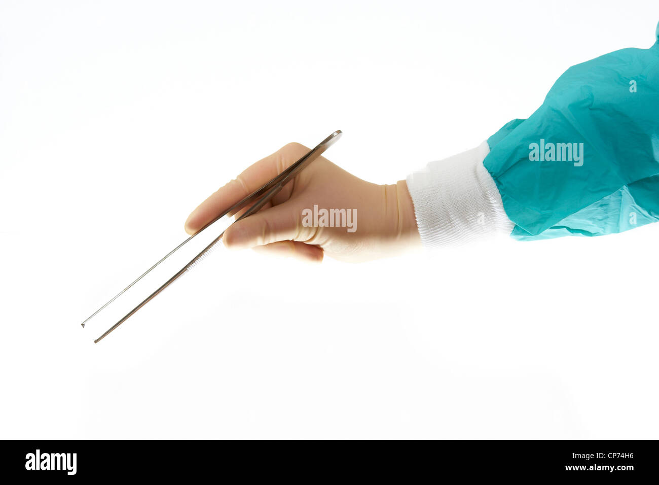 Surgical foreceps held by surgeons hand Stock Photo - Alamy