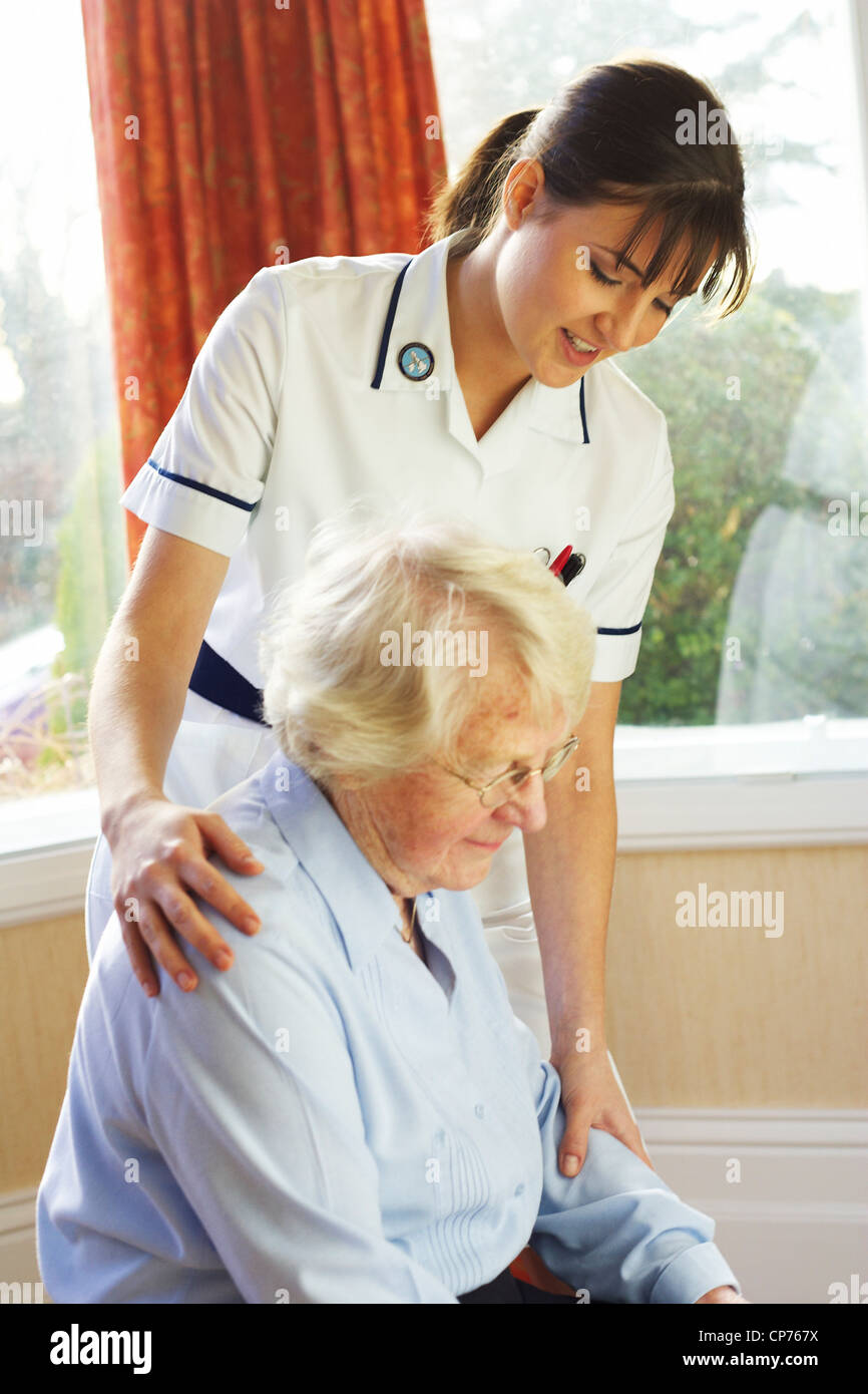 District nurse giving advice on home visit Stock Photo - Alamy