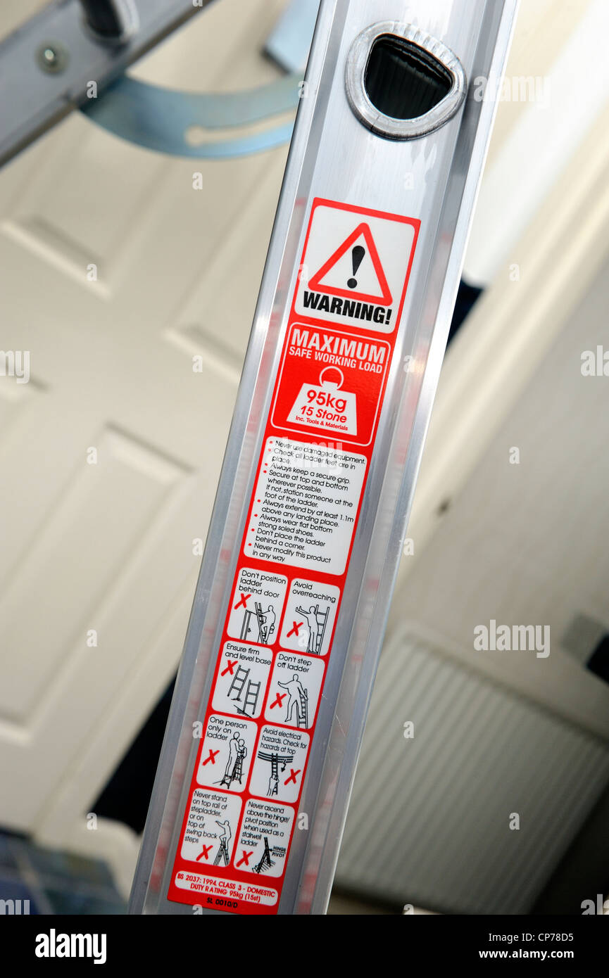stepladders with warning sign and instructions for safe use Stock Photo ...