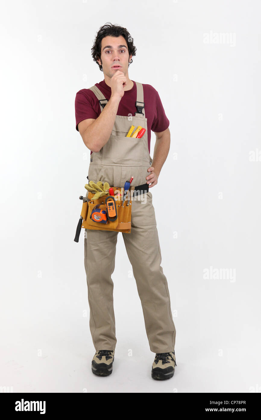 standing craftsman looks puzzled Stock Photo - Alamy