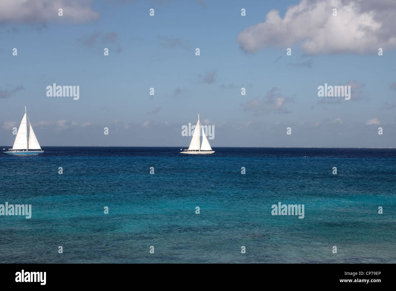 Two yachts sailing at sea on blue waters Stock Photo - Alamy