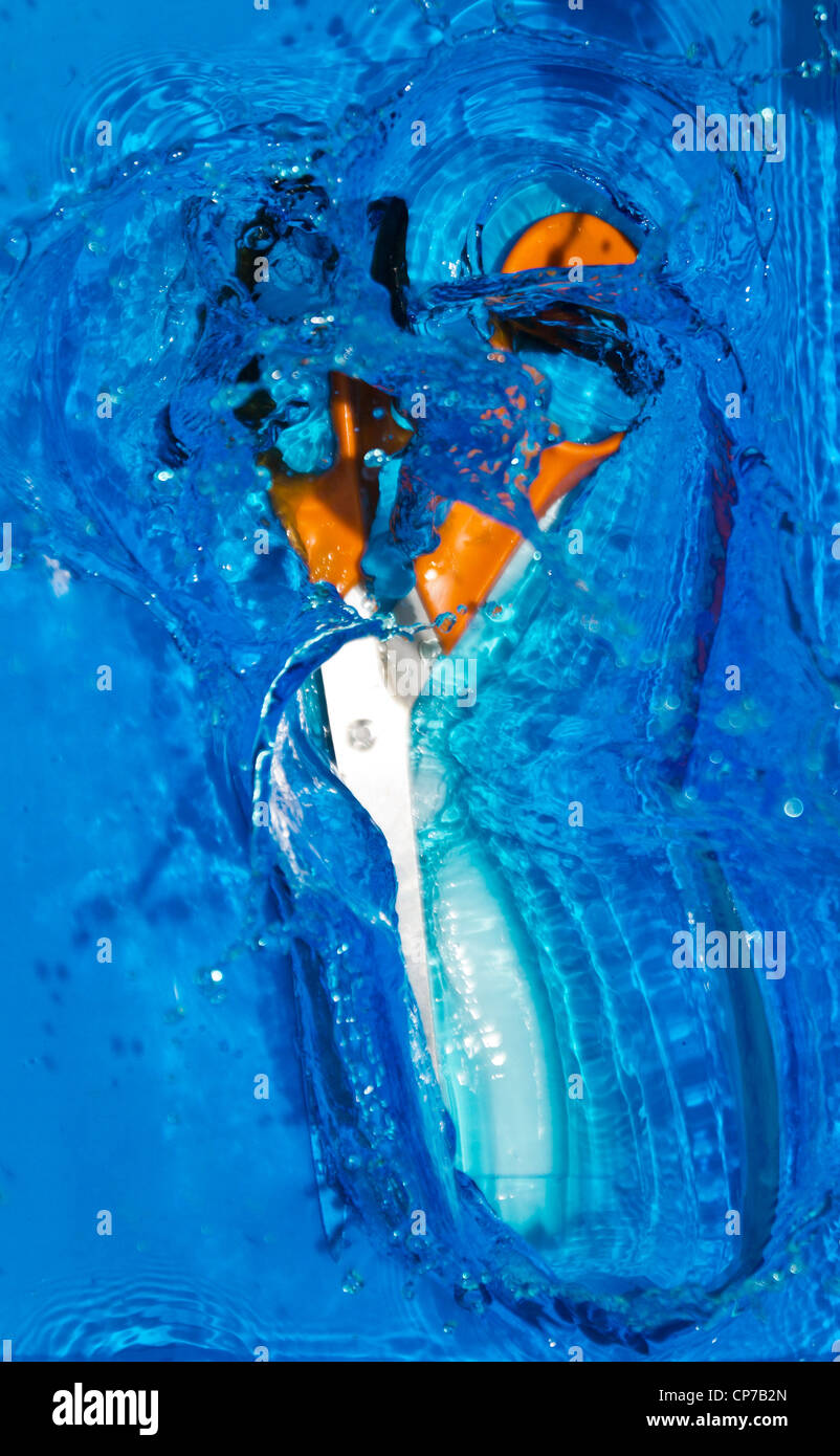 Scissors under water Stock Photo - Alamy