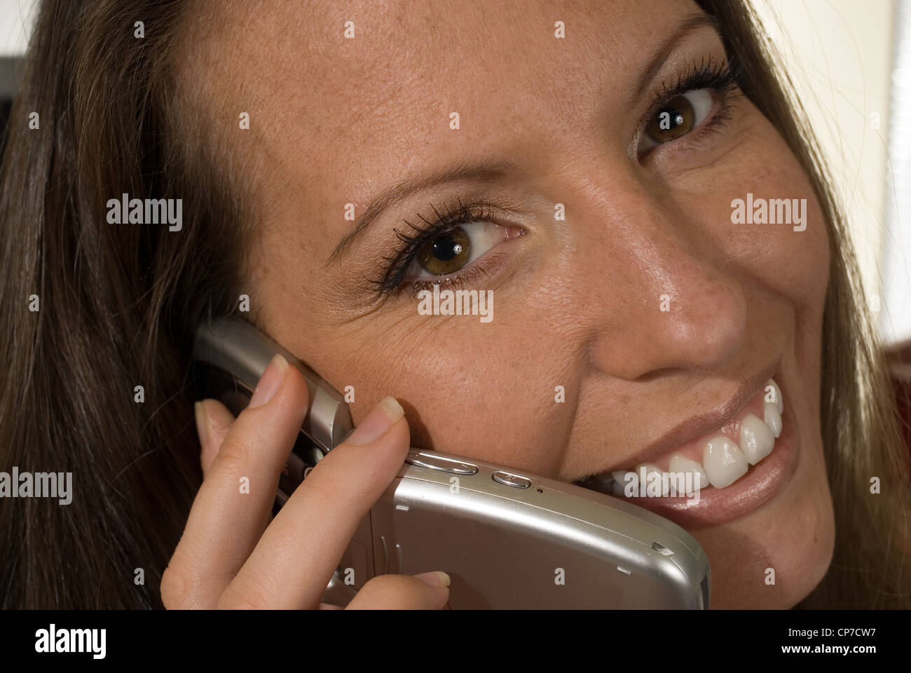 Pretty Secretary or Administrative Assistant Talking on Cell Phone in ...