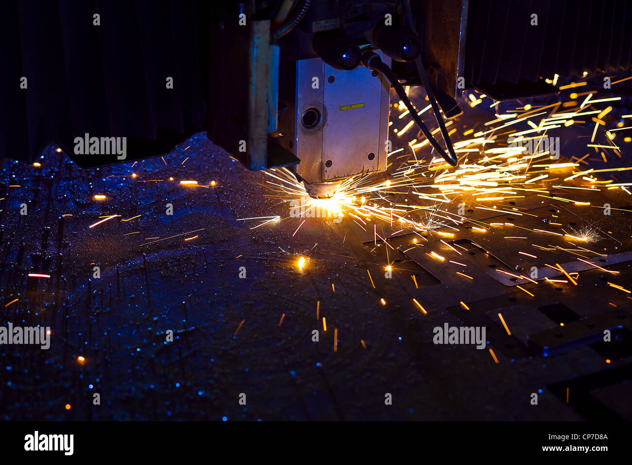 Laser cutting with sparks close up Stock Photo - Alamy