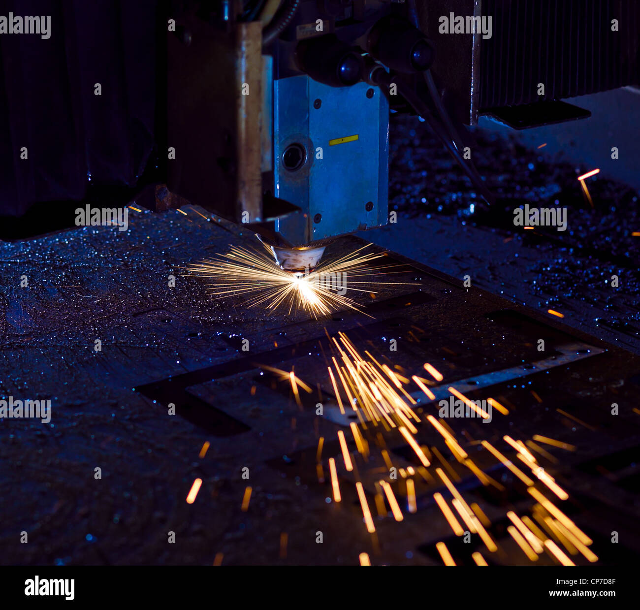 Laser cutting with sparks close up Stock Photo - Alamy