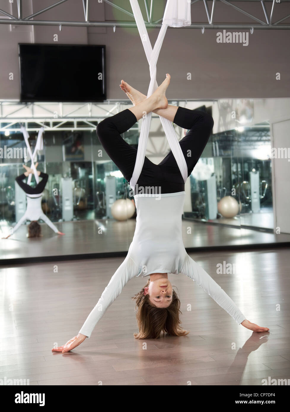 Woman doing anti-gravity exercise in fitness center Stock Photo - Alamy