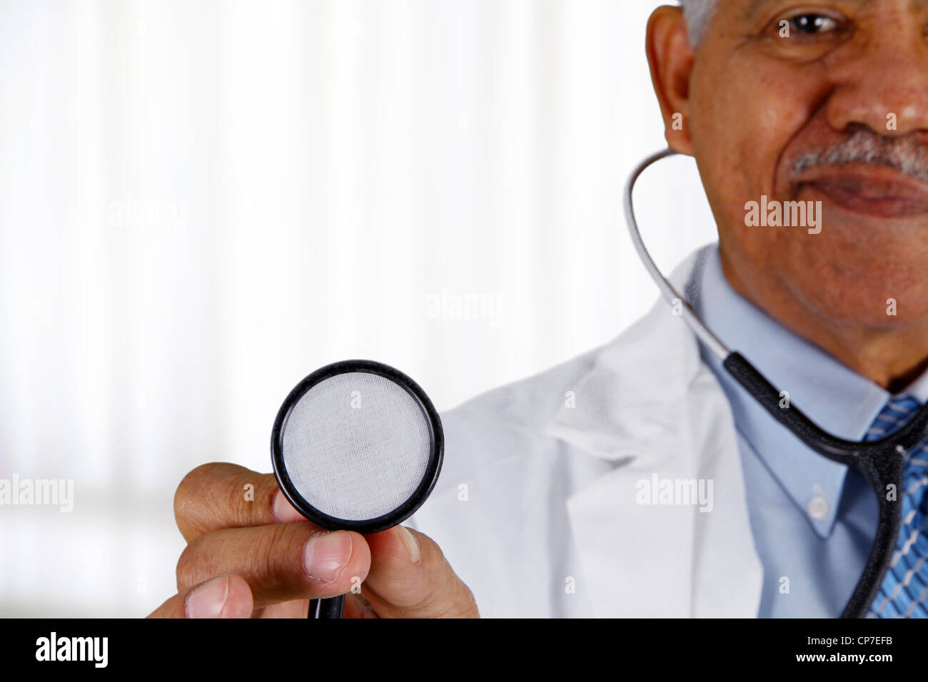 Minority senior doctor working at the hospital Stock Photo - Alamy