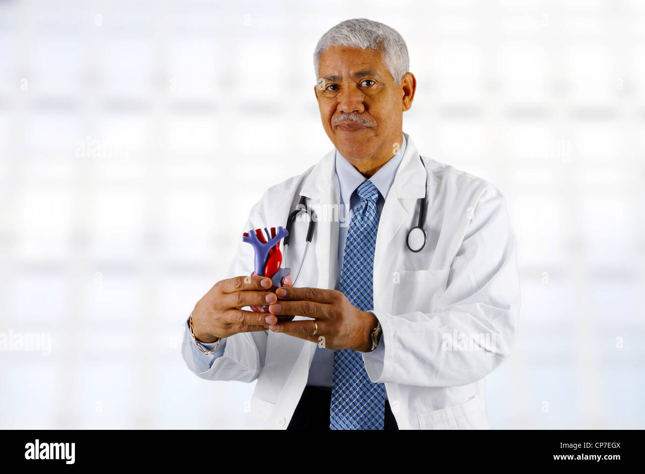 Minority senior doctor working at the hospital Stock Photo - Alamy