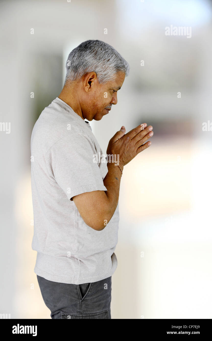 Senior citizen praying hi-res stock photography and images - Alamy