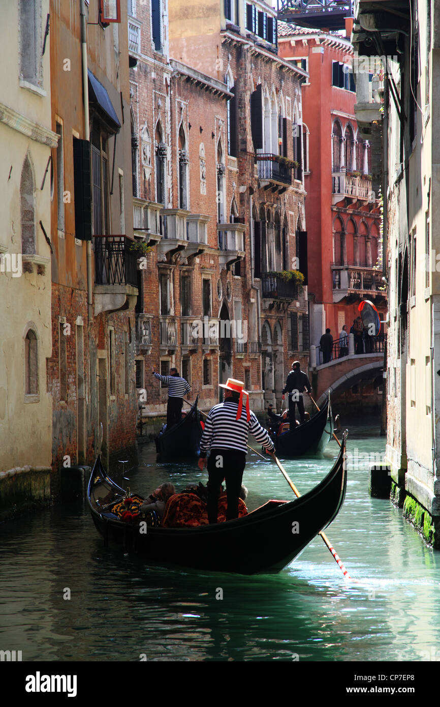 Gondola's moving down narrow Venetian canal Stock Photo - Alamy