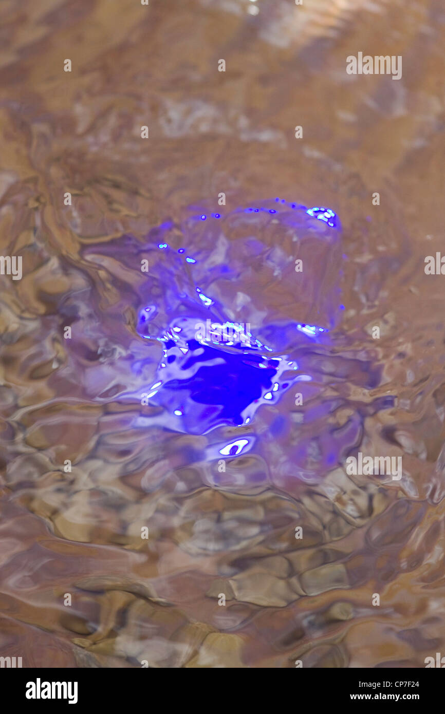 Water Feature patterns with a blue light Stock Photo - Alamy