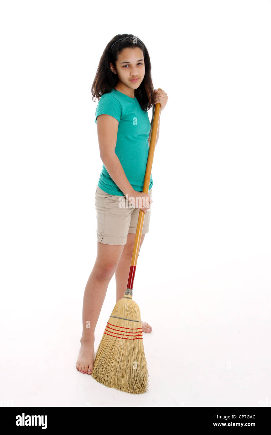 Teen Girl Doing Her Chore of Sweeping Stock Photo - Alamy