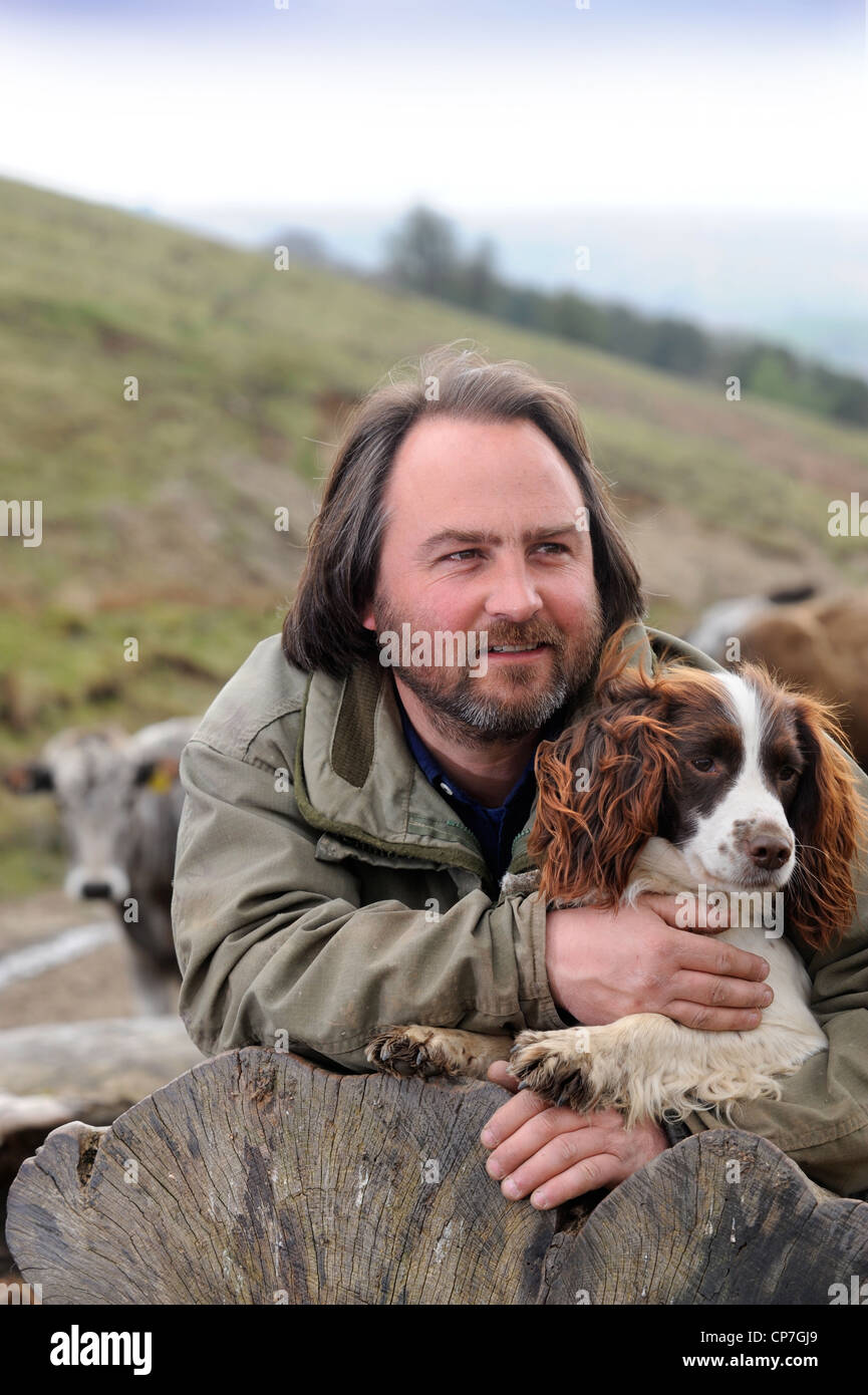 A cattle farmer with his Springer Spaniel dog Wales, UK Stock Photo - Alamy