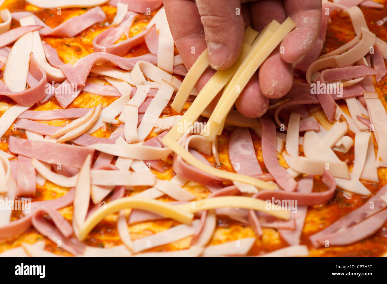 chef puts cheese on the pizza Stock Photo - Alamy