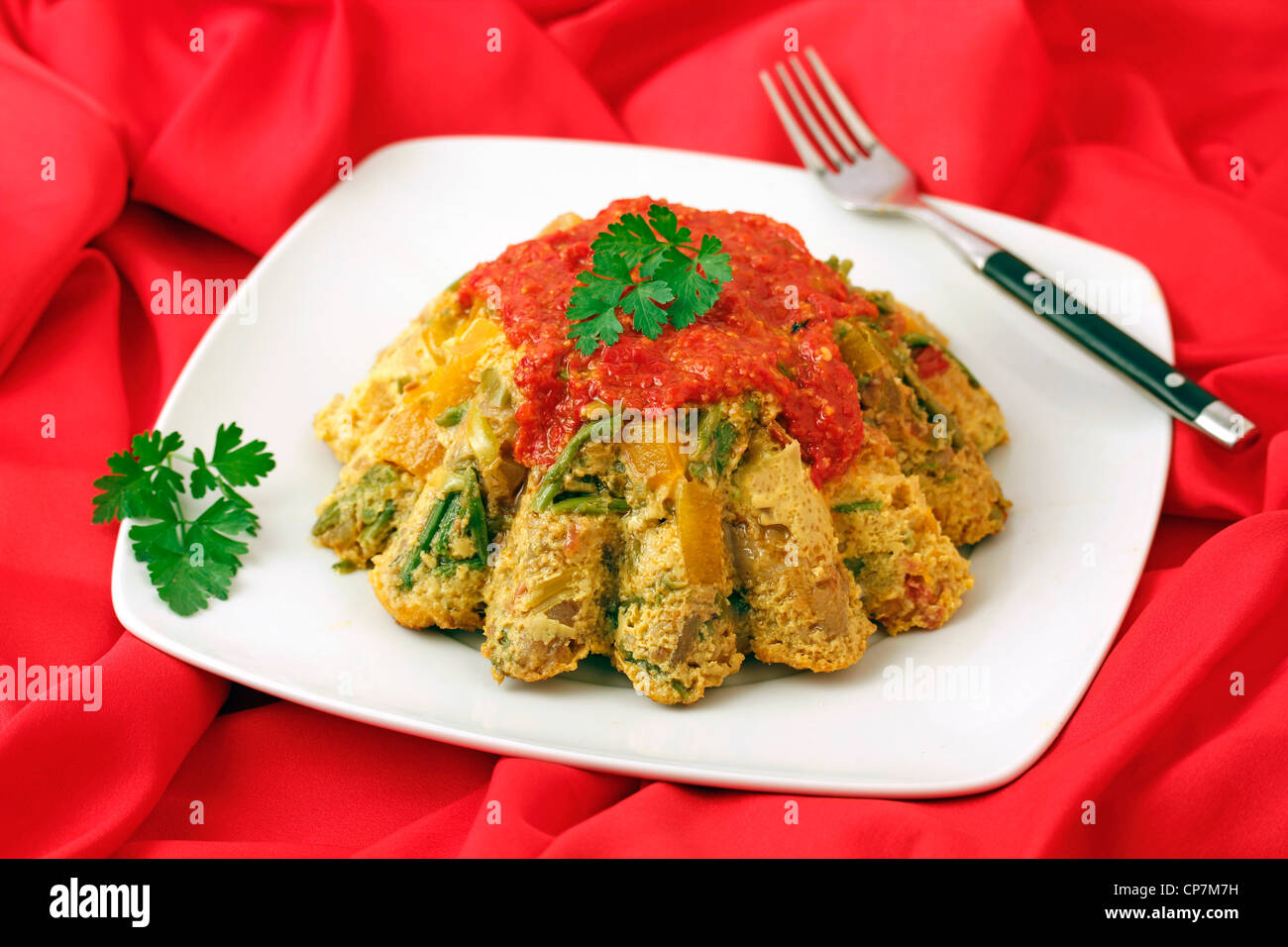 Seafood and vegetables pudding. Recipe available Stock Photo - Alamy