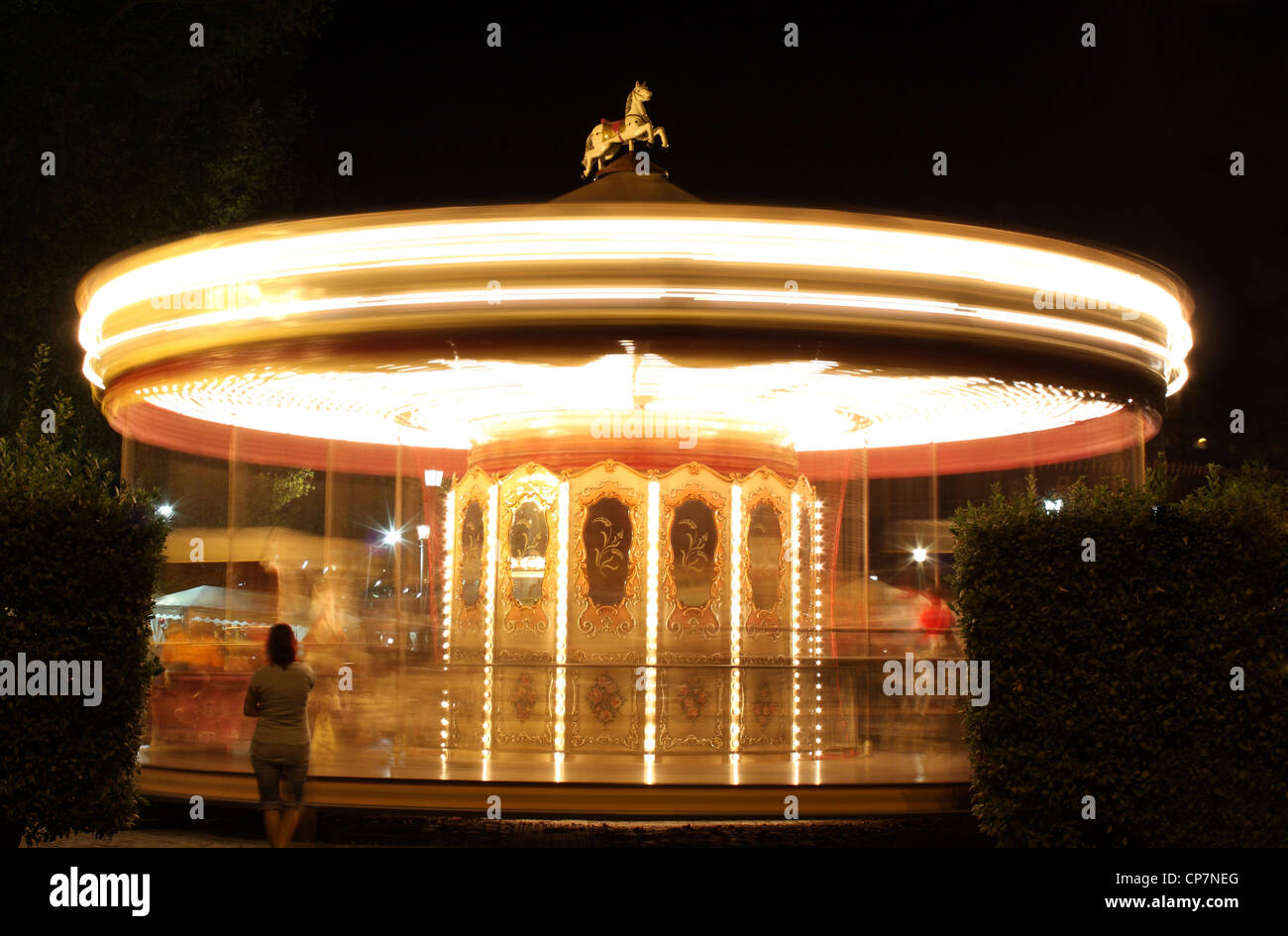 A spinning carousel on the night of Rome Stock Photo - Alamy