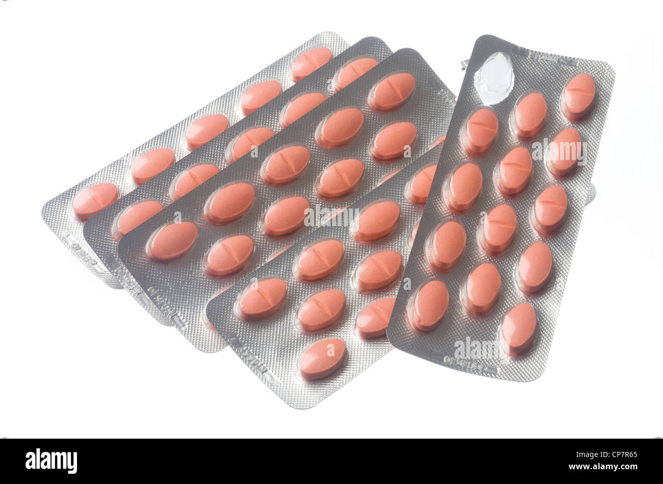 Pink pills, drugs blister on white background Stock Photo - Alamy
