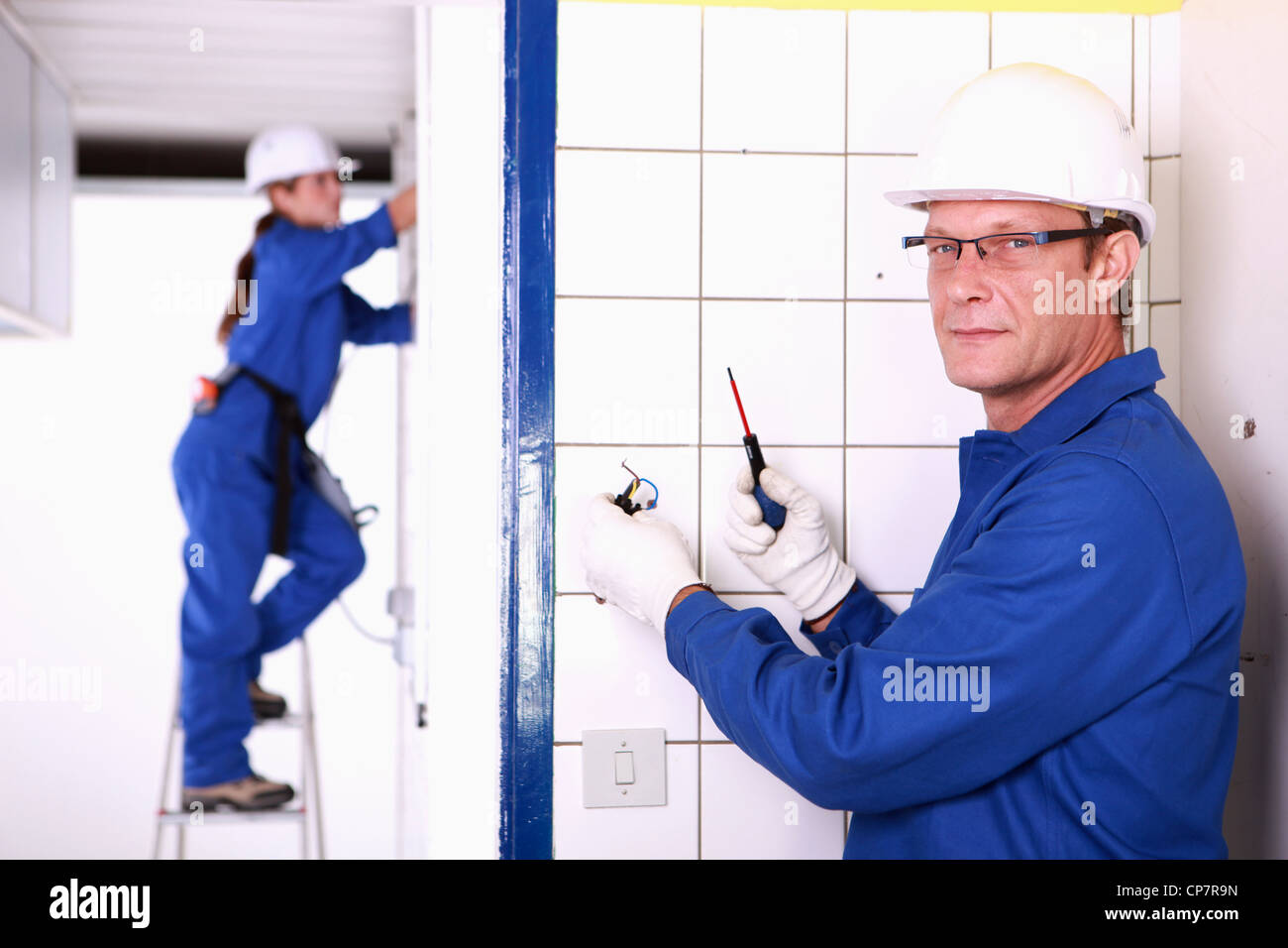 Electricians wiring a house Stock Photo - Alamy