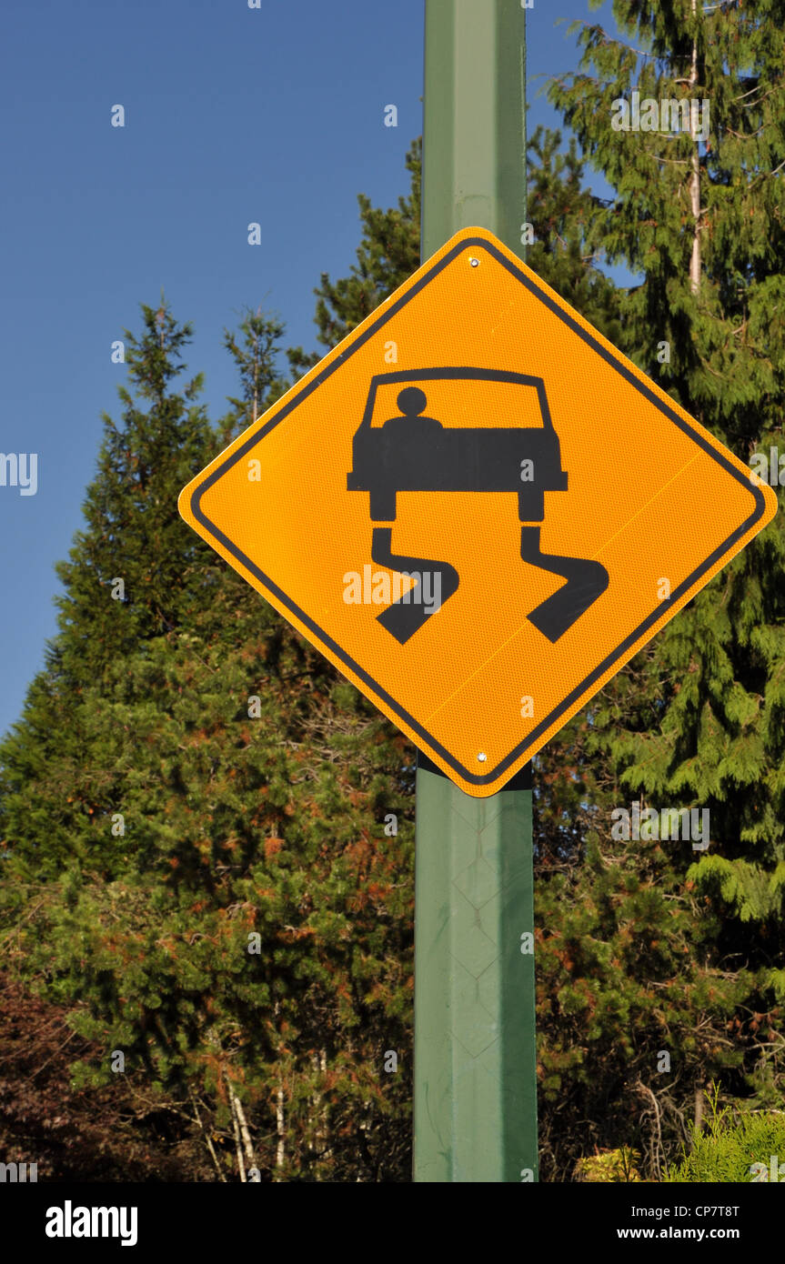 Slippery road sign Stock Photo - Alamy