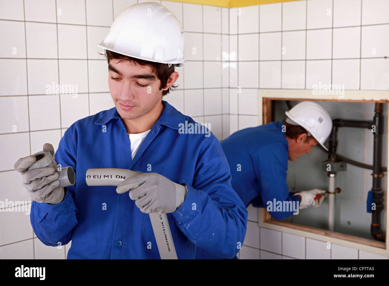 Two plumbers work hi-res stock photography and images - Alamy