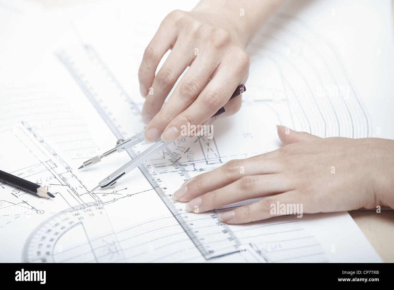 Hands of engineer working on a construction plan Stock Photo - Alamy