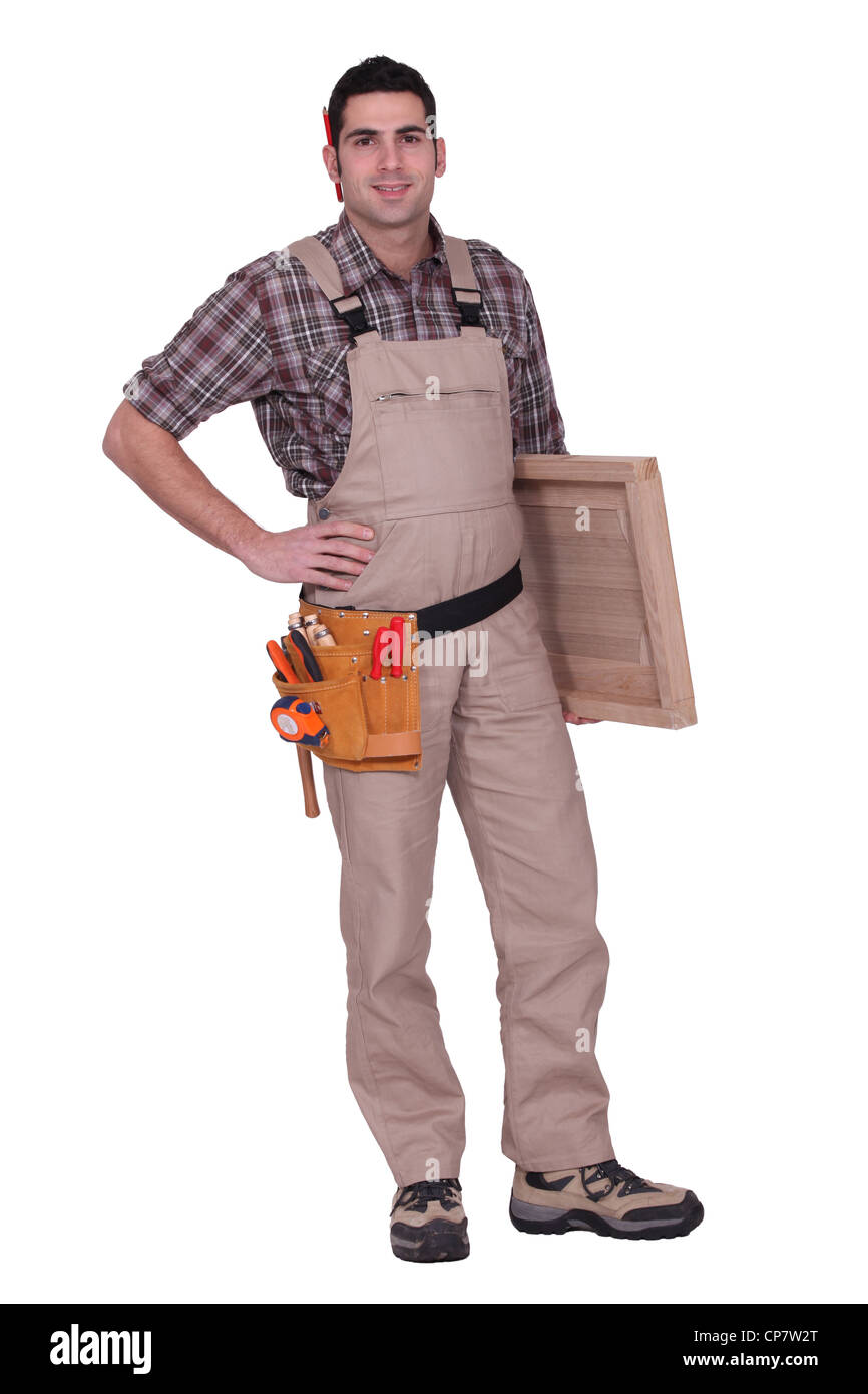 Carpenter with wooden door Stock Photo - Alamy
