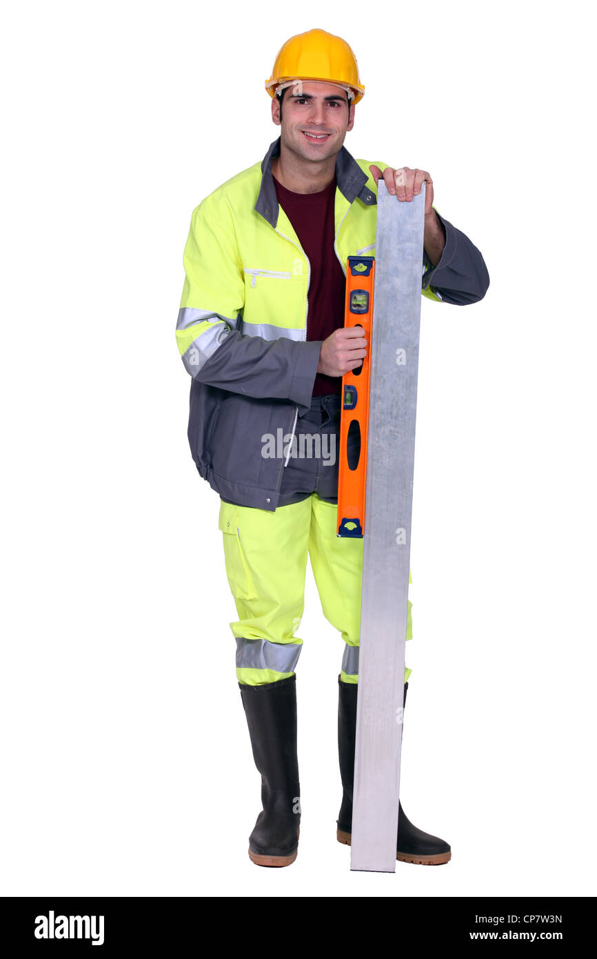 Man using spirit-level Stock Photo - Alamy