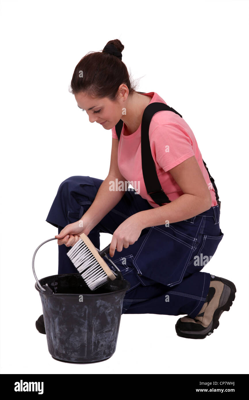 Woman brush bucket paint Cut Out Stock Images & Pictures - Alamy