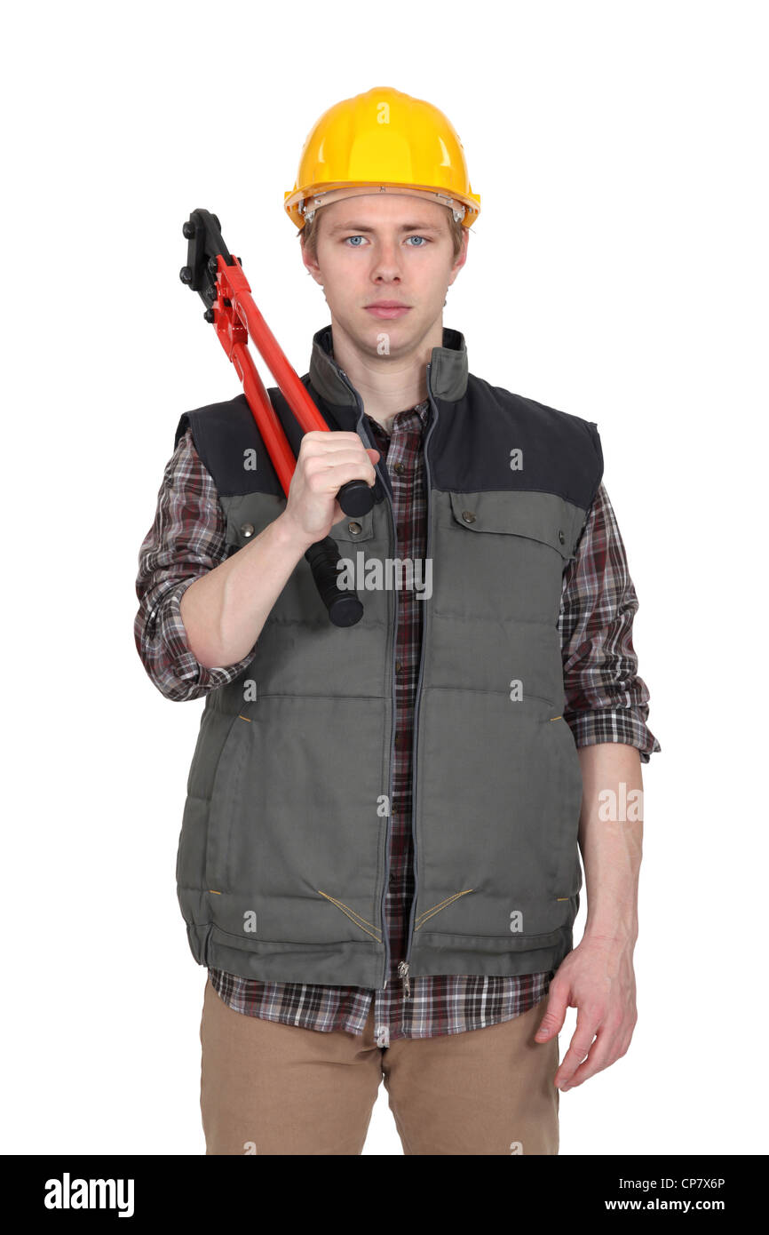 Tradesman holding large clippers Stock Photo - Alamy