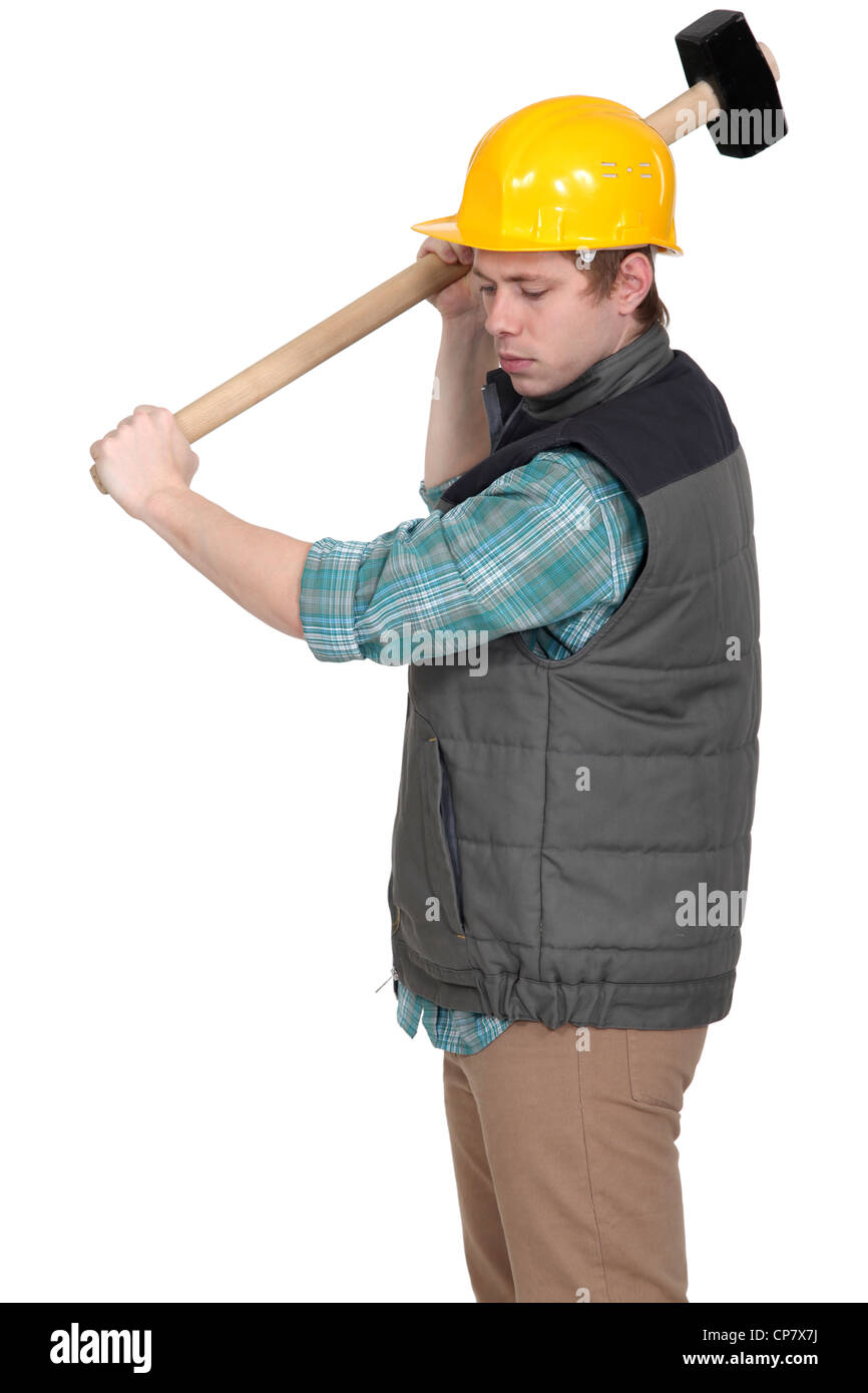 Laborer with hammer Stock Photo - Alamy