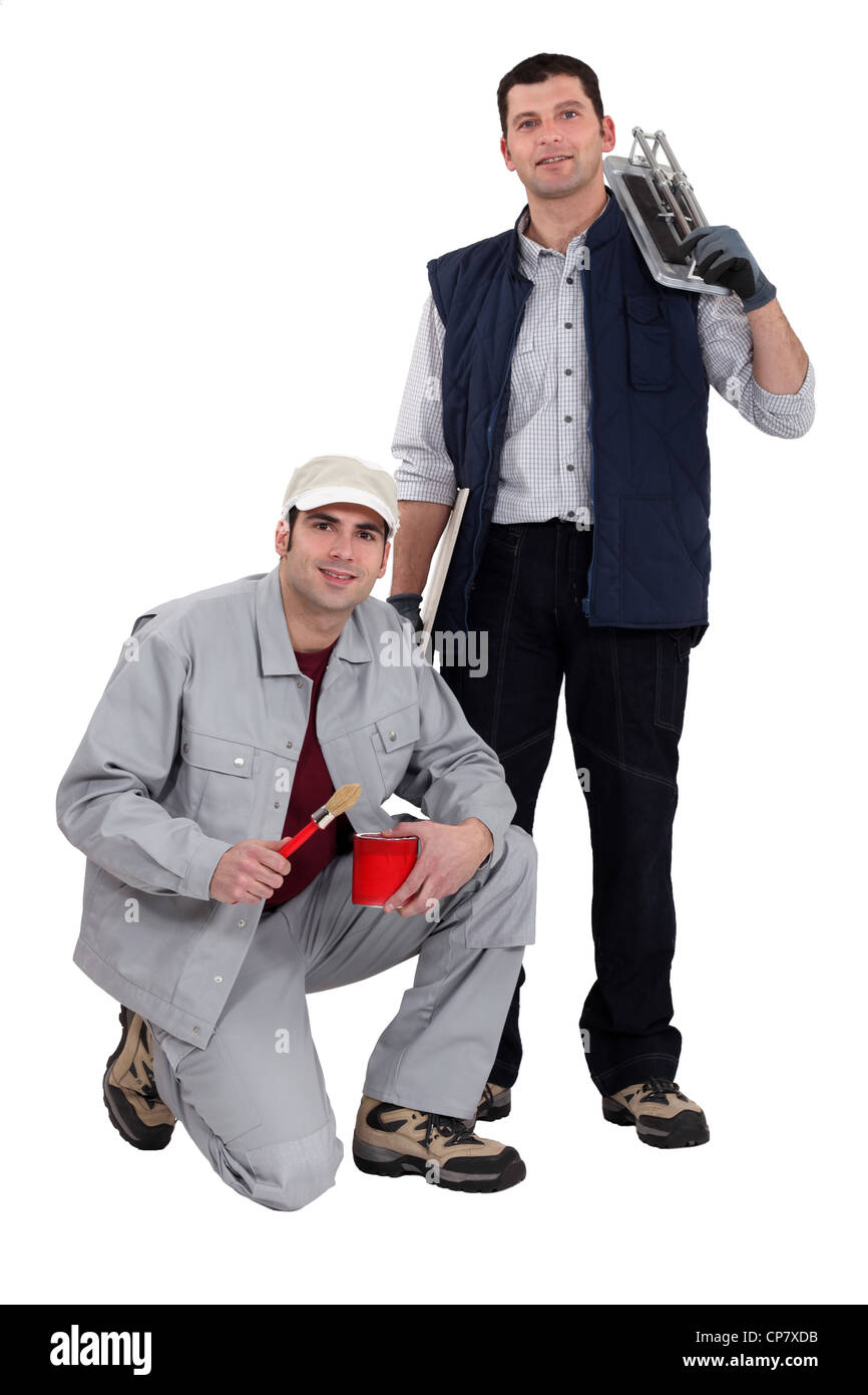 A team of tradesmen posing with their tools Stock Photo - Alamy