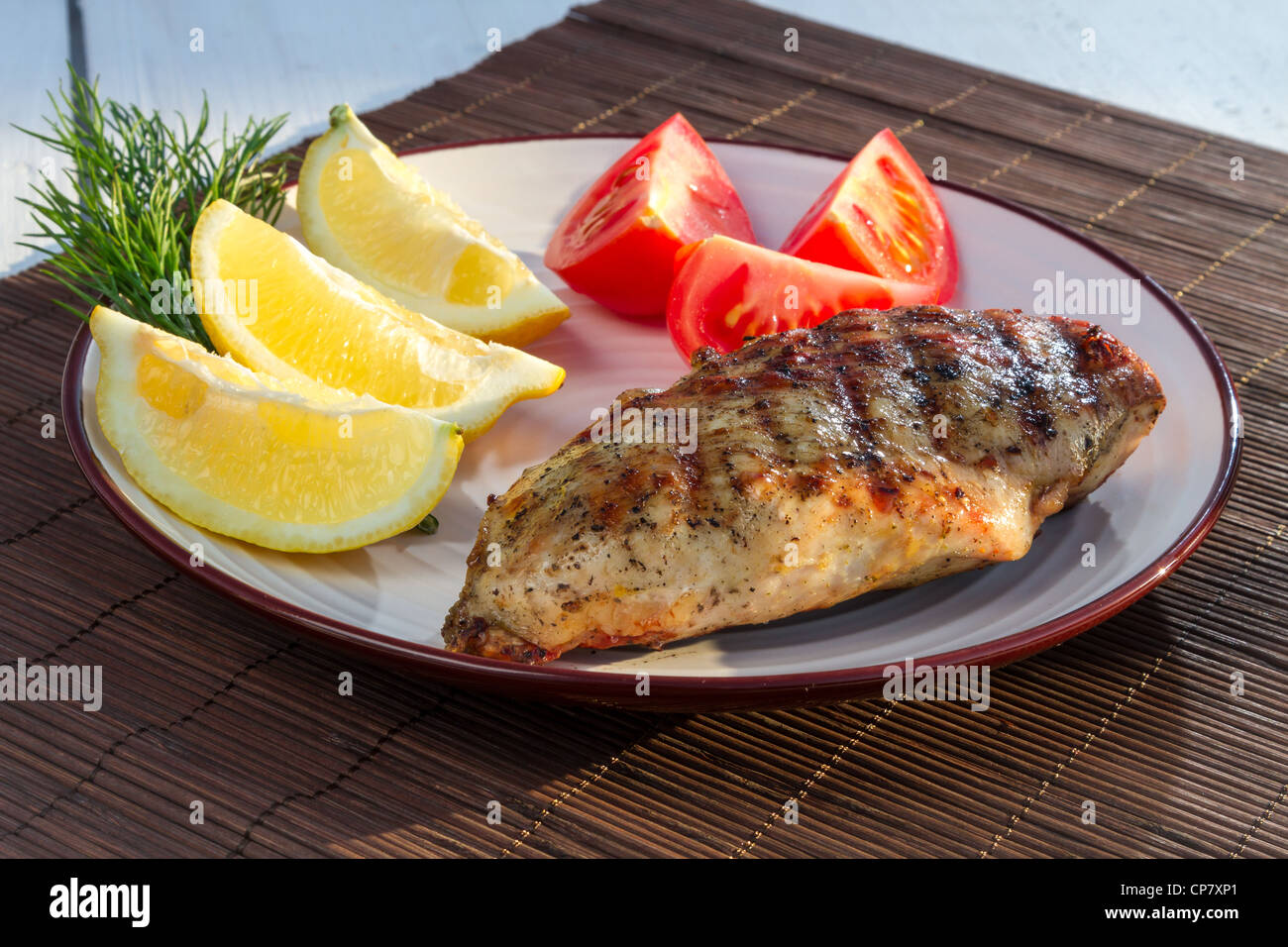 Roasted chicken served with vegetables Stock Photo - Alamy