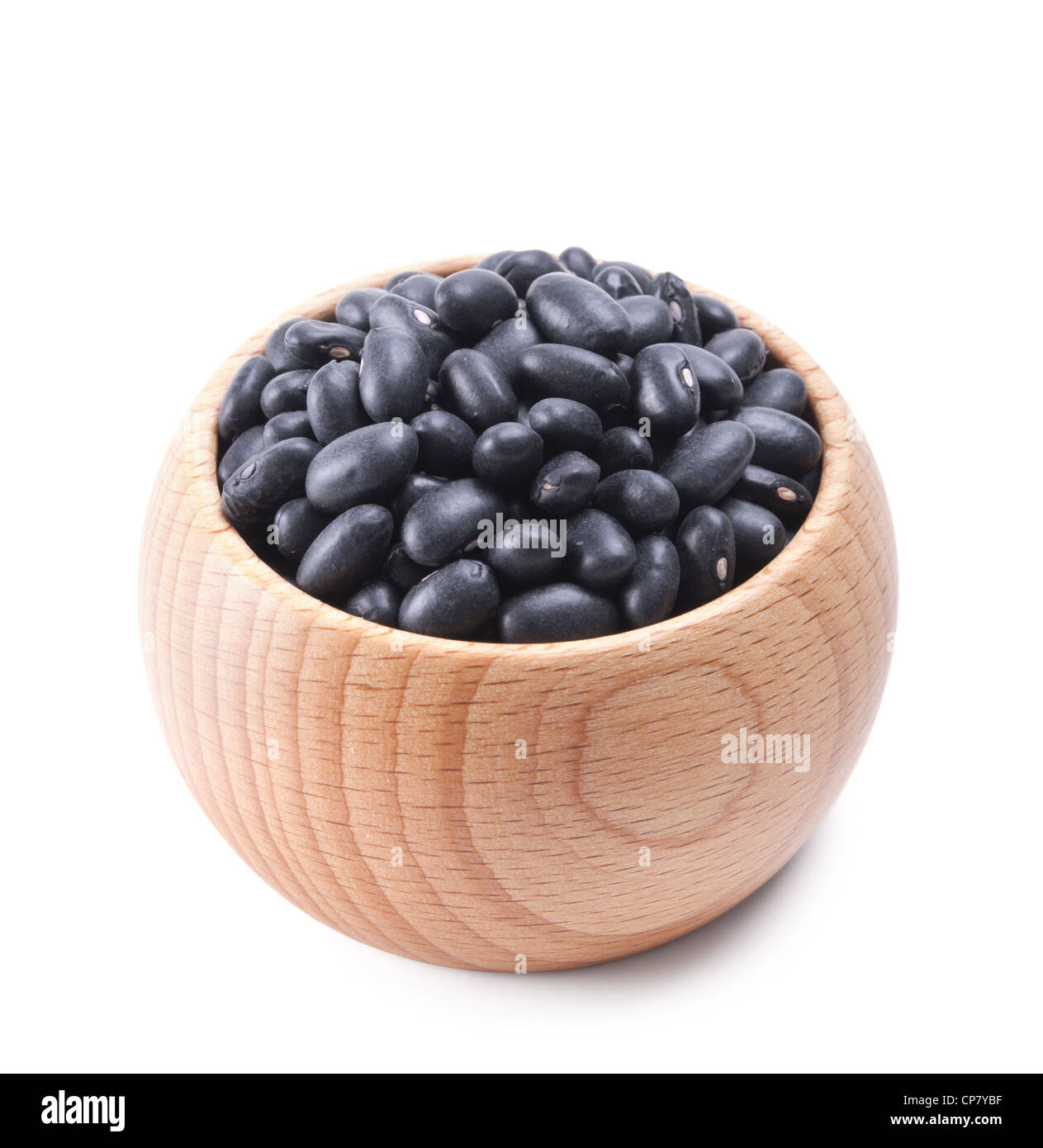 wooden bowl full of black small beans isolated on white background ...