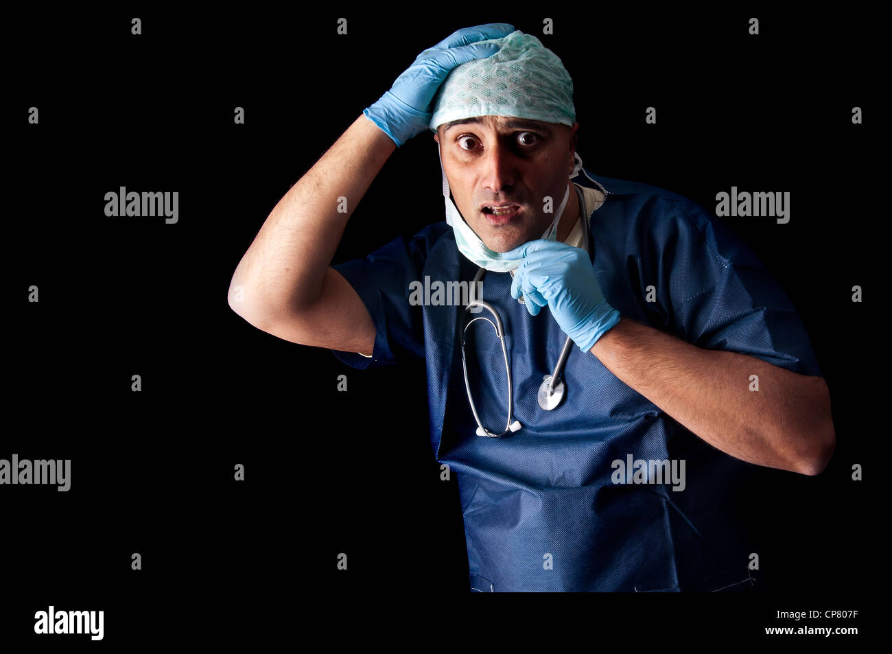 Stressed doctor in a dark background Stock Photo - Alamy