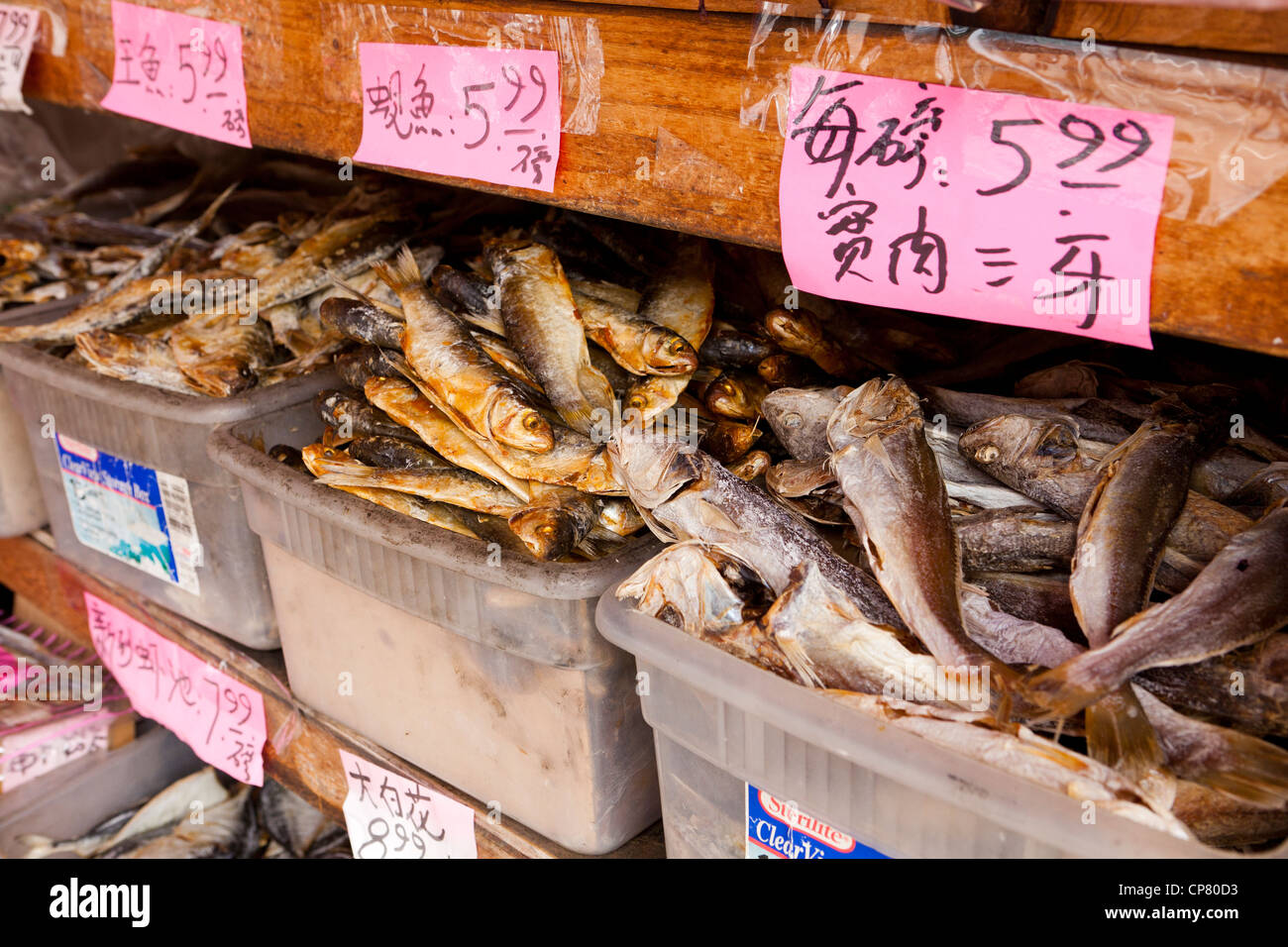 Dried whole fish in bins at the Chinese market Stock Photo - Alamy