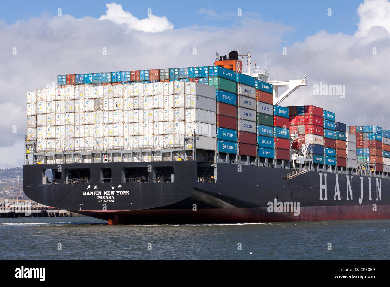 The stern side of a Hanjin cargo ship showing stacked containers at ...