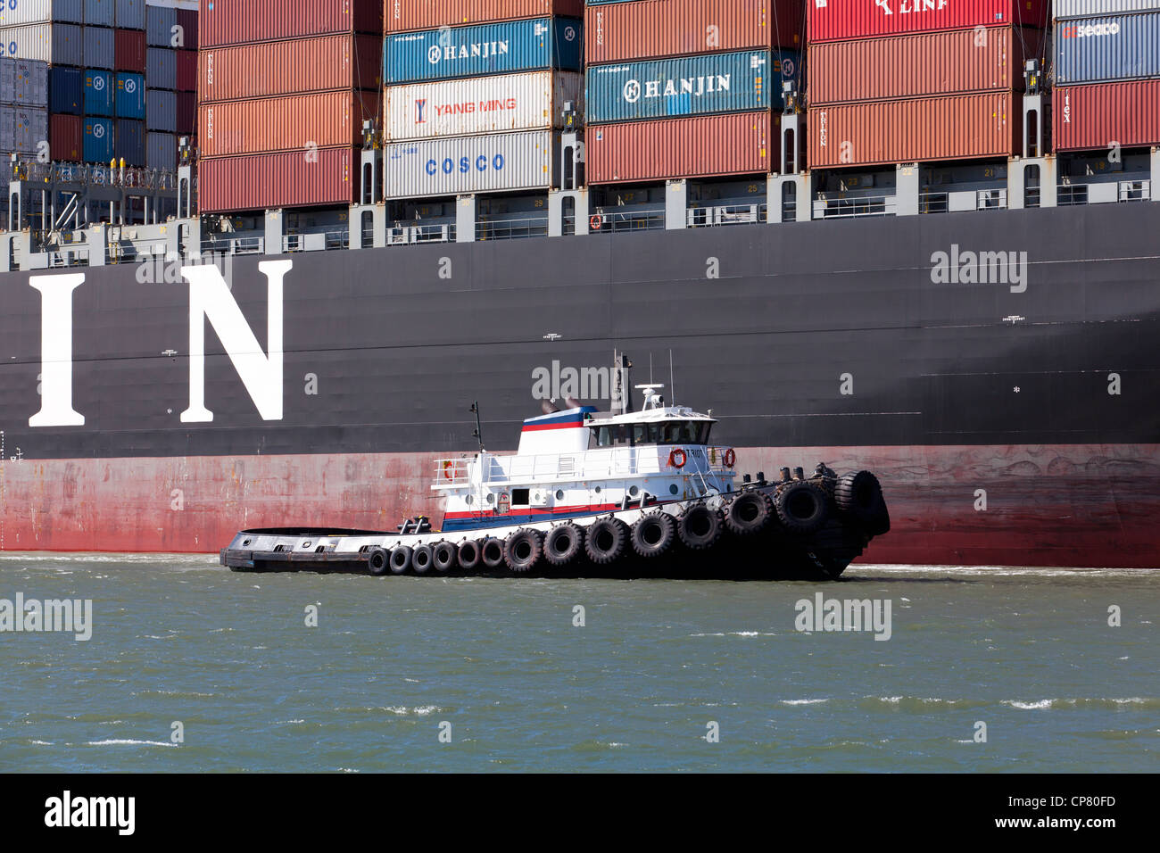 Hanjin shipping container ship, flagged by a tugboat, entering port of ...