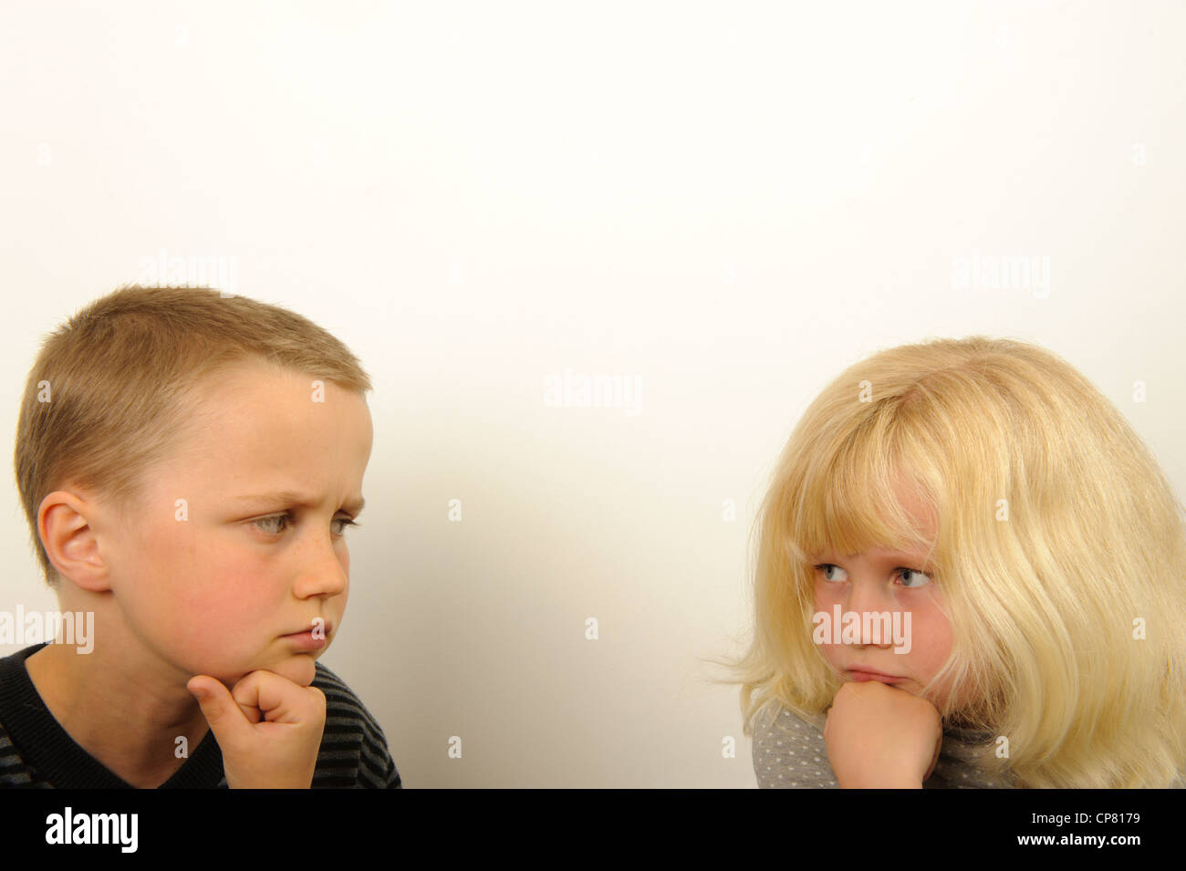 Stock Photo of two children thinking Stock Photo - Alamy