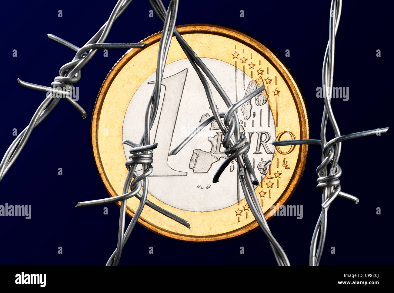 coin behind barbed wire Stock Photo - Alamy