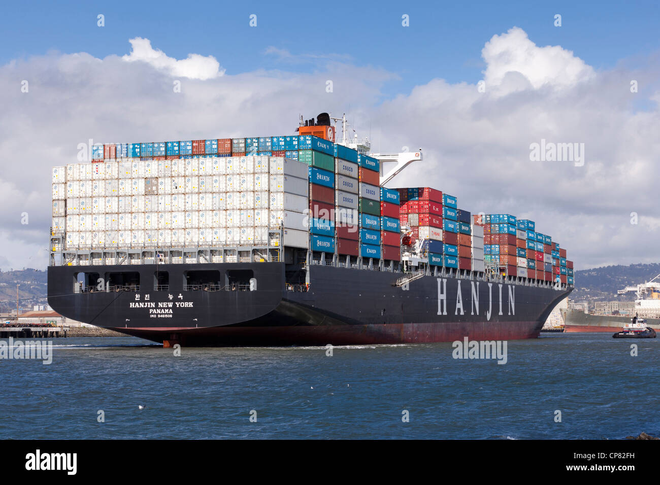 The stern side of a Hanjin cargo ship showing stacked containers at ...