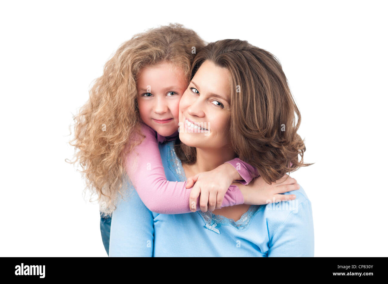 Beautiful And Happy Young Mother And Small Daughter Smiling Isolated On White Background Stock