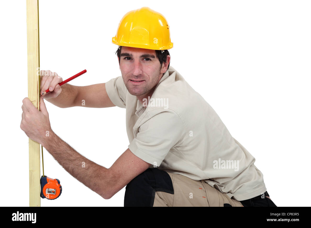 Carpenter marking plank of wood Stock Photo - Alamy