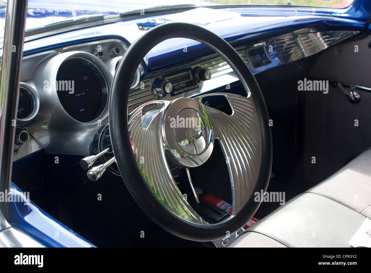 Steering wheel and dashboard of 1957 Chevrolet at a classic car show in ...
