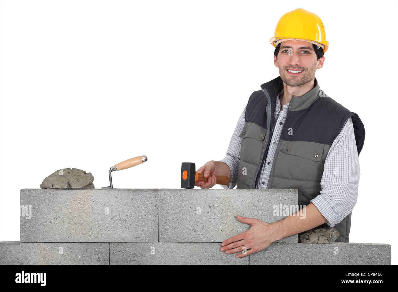 Man building wall Stock Photo - Alamy